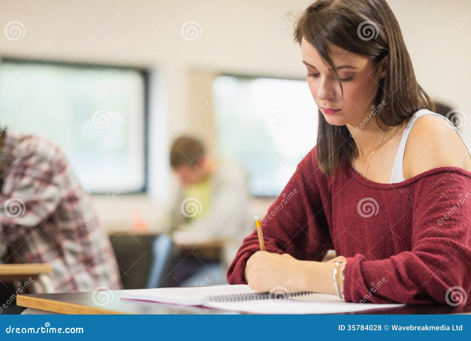Student Writing Notes in the Classroom Stock Photo - Image of women ...