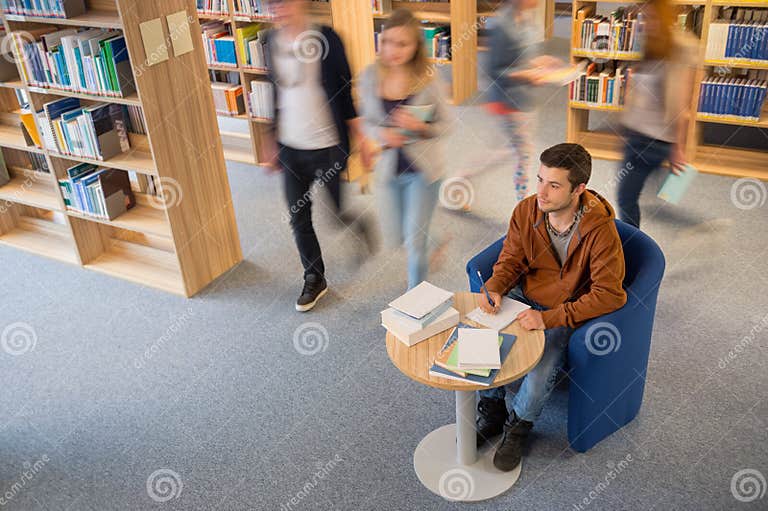 Student Writing Notes in Library Blur Motion Stock Photo - Image of ...