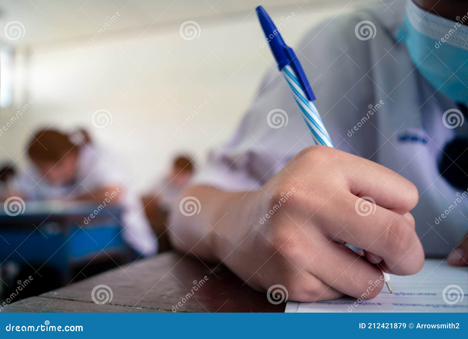 Student Writing Pen in Hand Doing Exams Answer Sheets Exercises in ...
