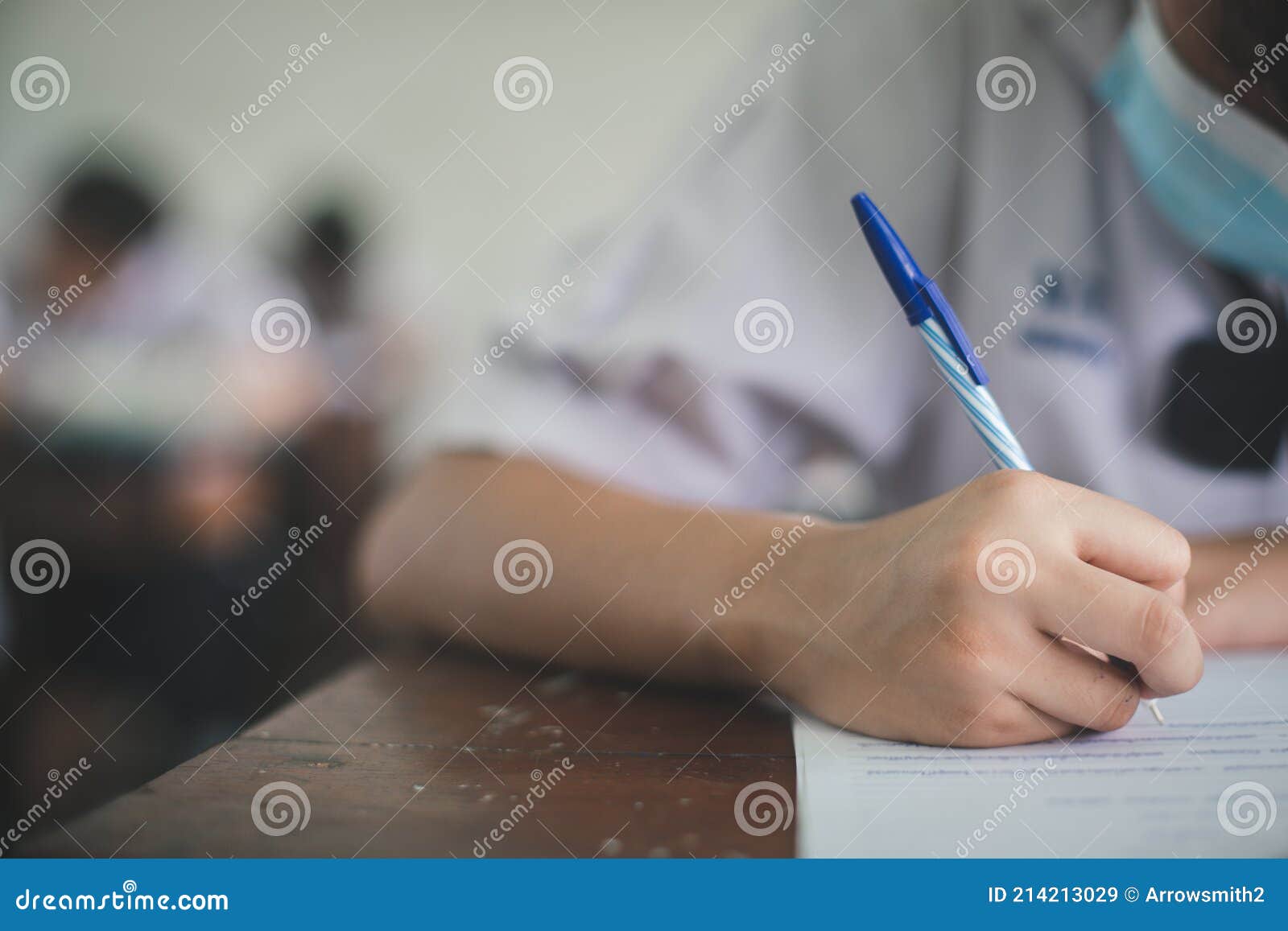Student Writing Pen in Hand Doing Exams Answer Sheets Exercises in ...
