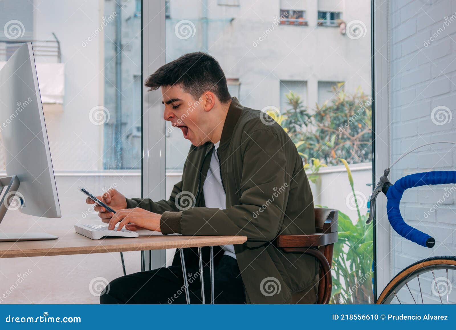 Student Yawning Bored with Computer and Mobile Stock Photo - Image of ...