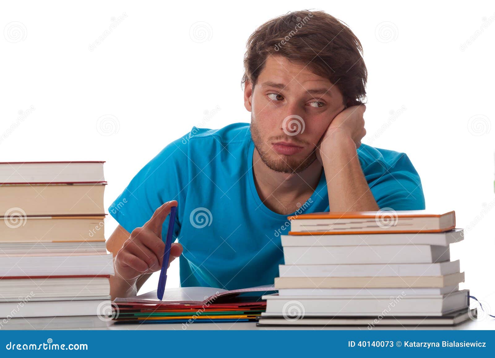 Studente Annoiato Che Si Siede Nella Biblioteca Immagine Stock ...