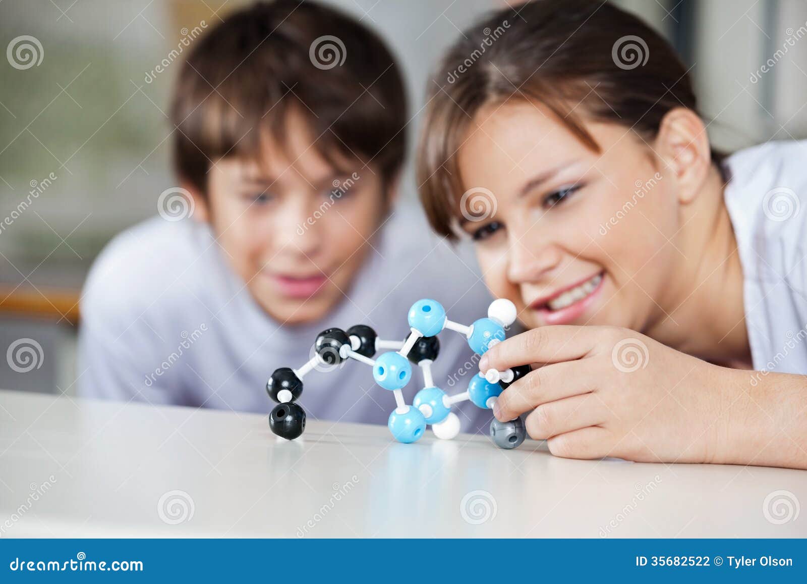 Students Analyzing Molecular Structure at Desk Stock Photo - Image of ...