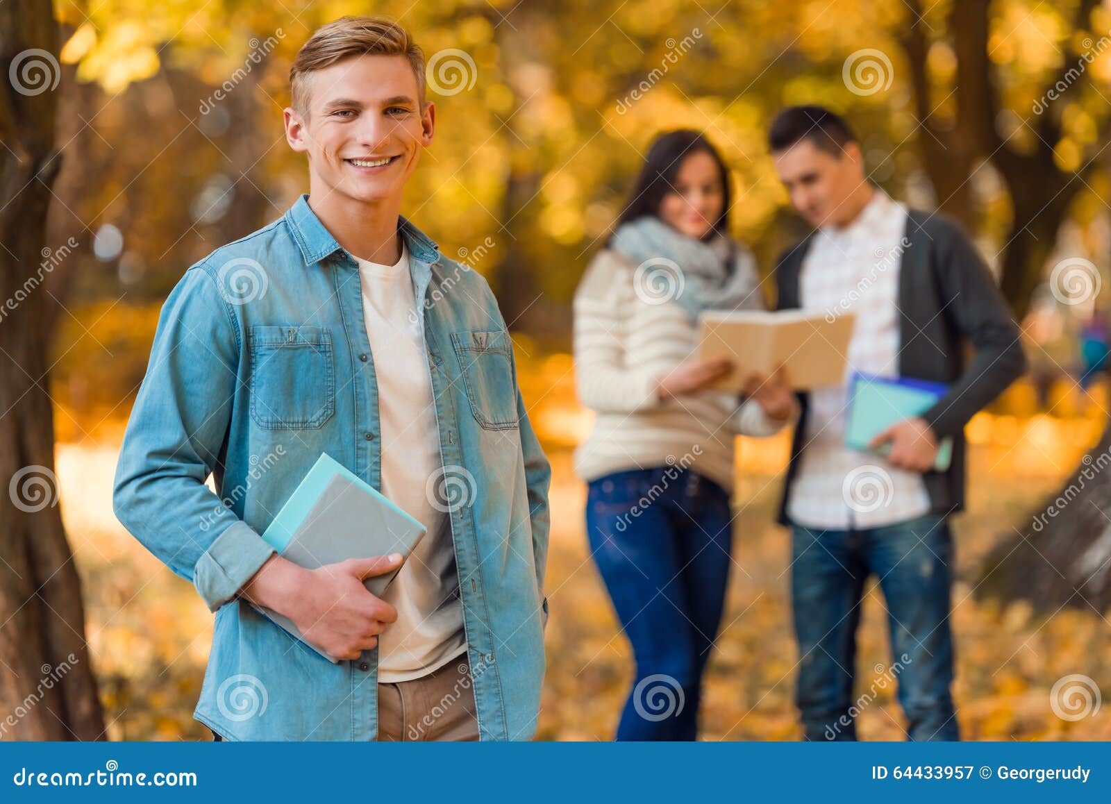 Students in autumn park stock image. Image of friendship - 64433957