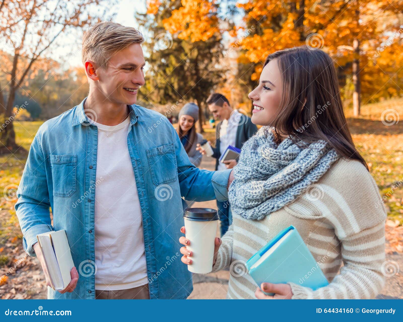 Students in autumn park stock photo. Image of holidays - 64434160