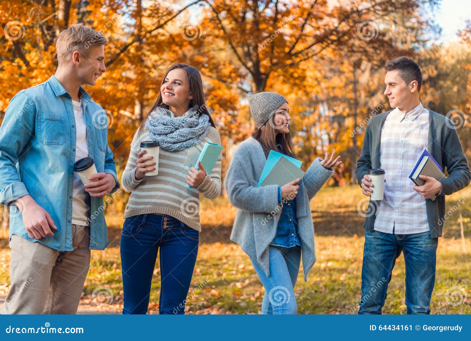 Students in autumn park stock image. Image of cheerful - 64434161