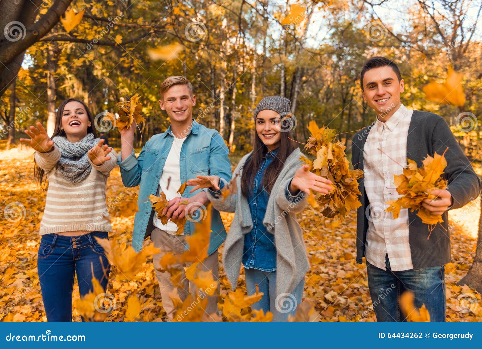Students in autumn park stock photo. Image of autumn - 64434262
