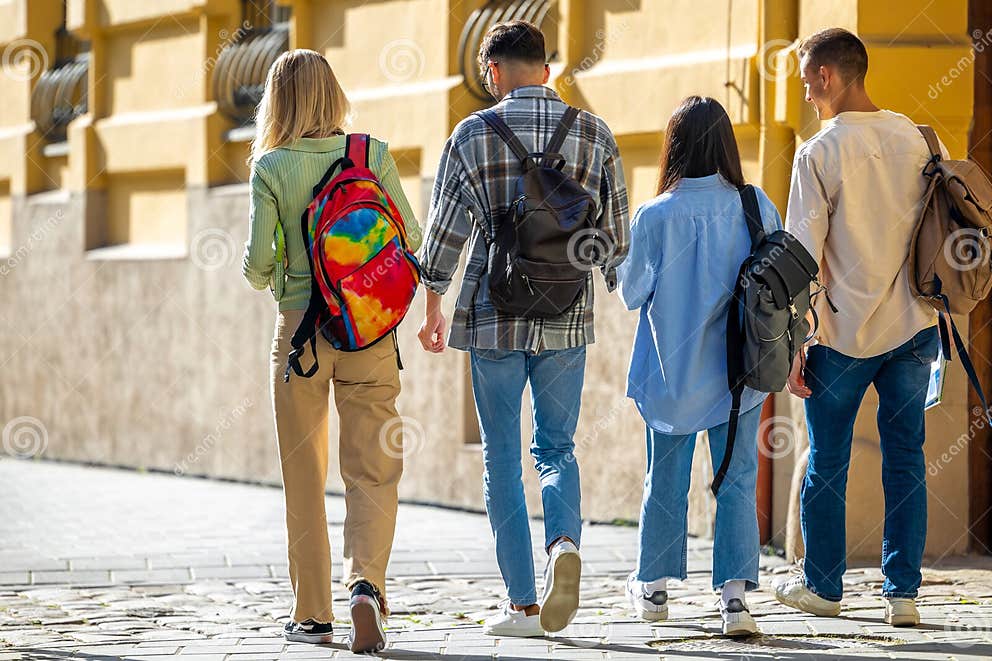 Students with Backpacks Walking at University Campus Together. Stock ...