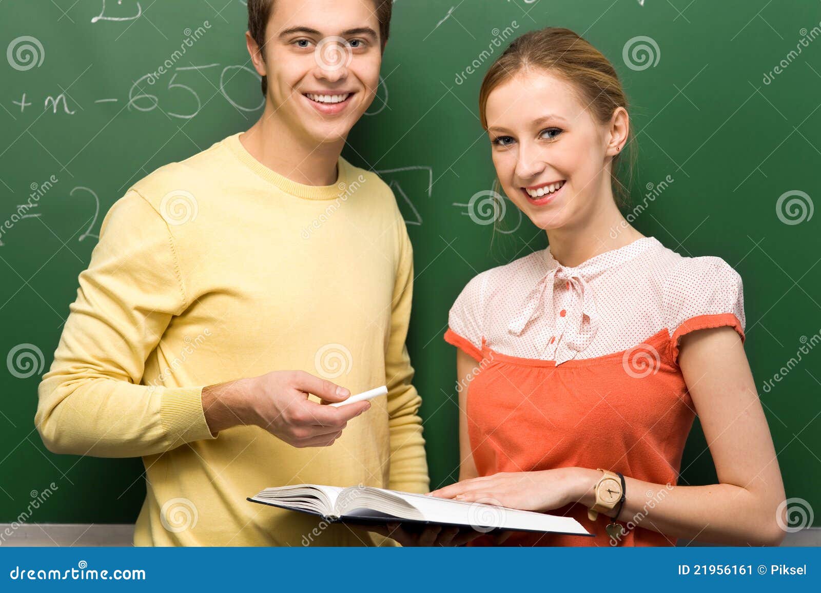 Students by blackboard stock image. Image of holding - 21956161