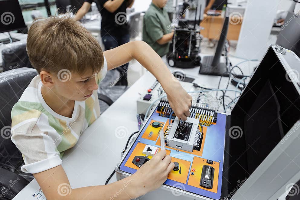 Students Boy Learning Electrical Appliances. Education on Table at ...
