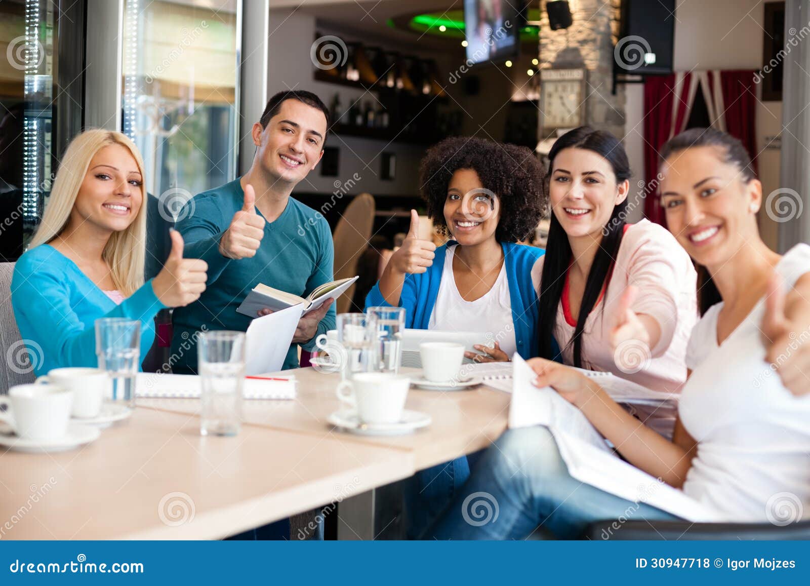 Students in Cafe Showing Thumbs Up Stock Photo - Image of leisure ...
