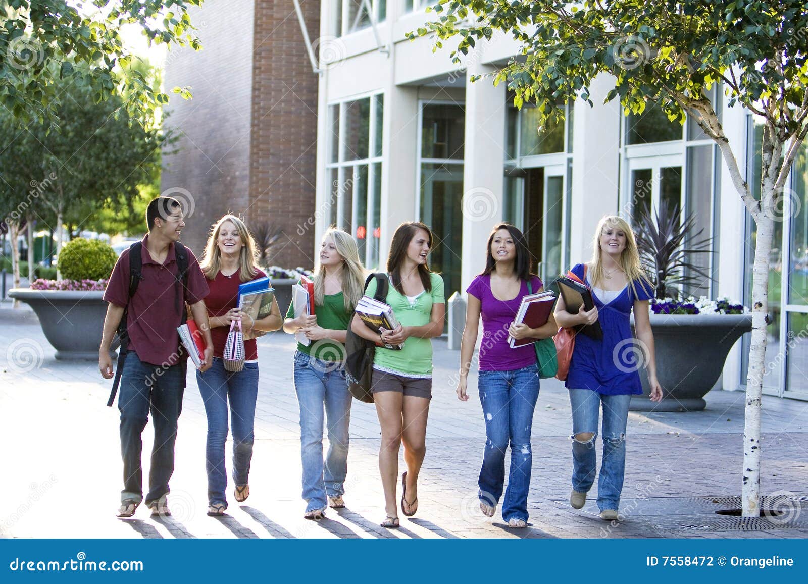 Students Carrying Books stock photo. Image of happiness - 7558472