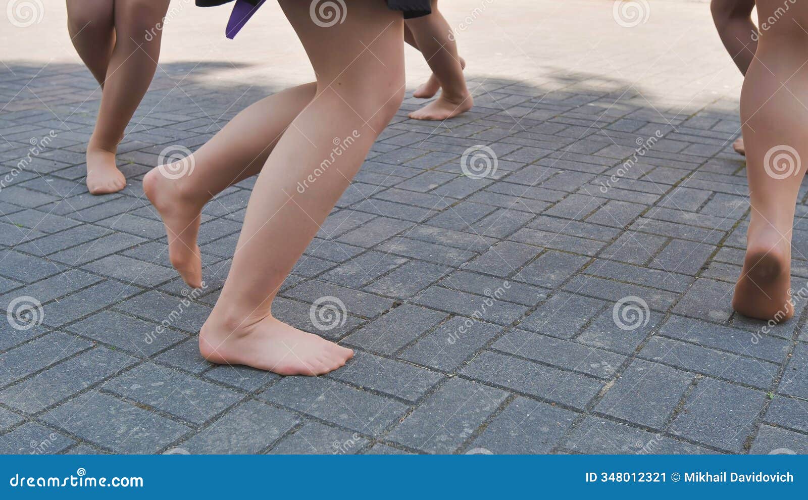 Students Celebrating End of School Year, Walking Barefoot on Pavement ...