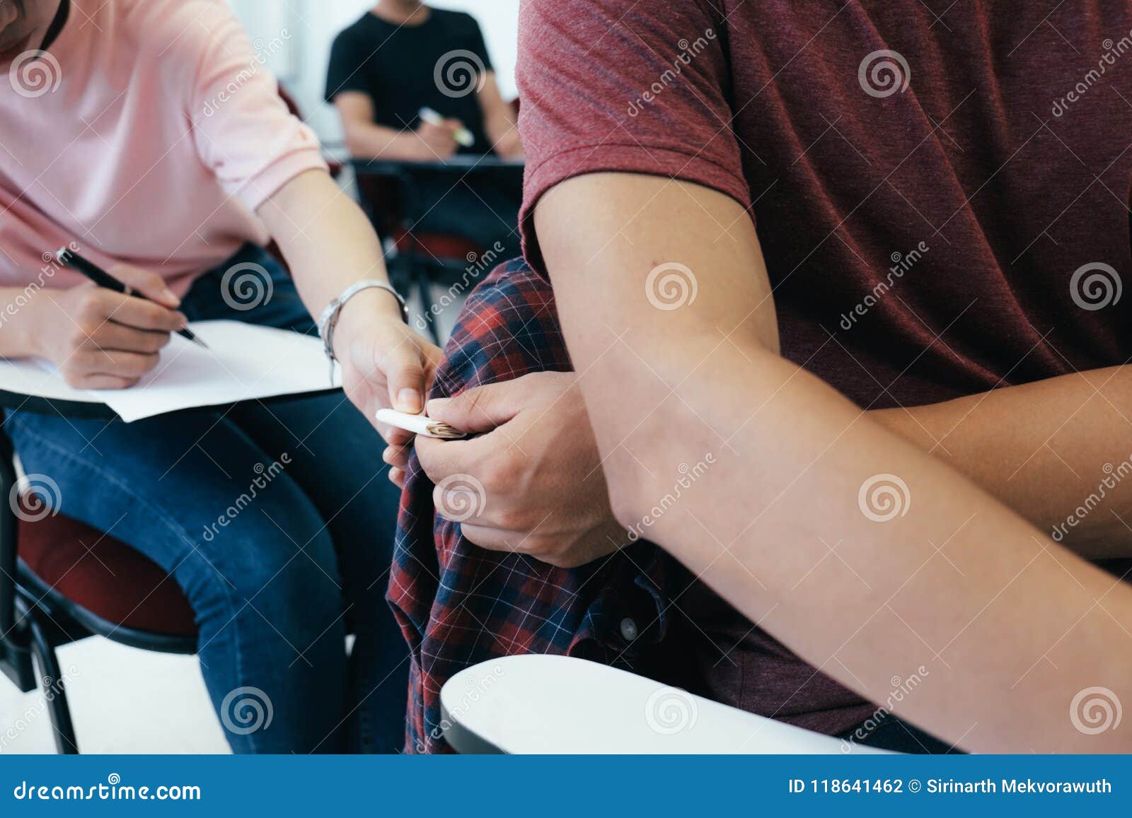 Students Cheating Passing Note on Examination. Stock Photo - Image of ...