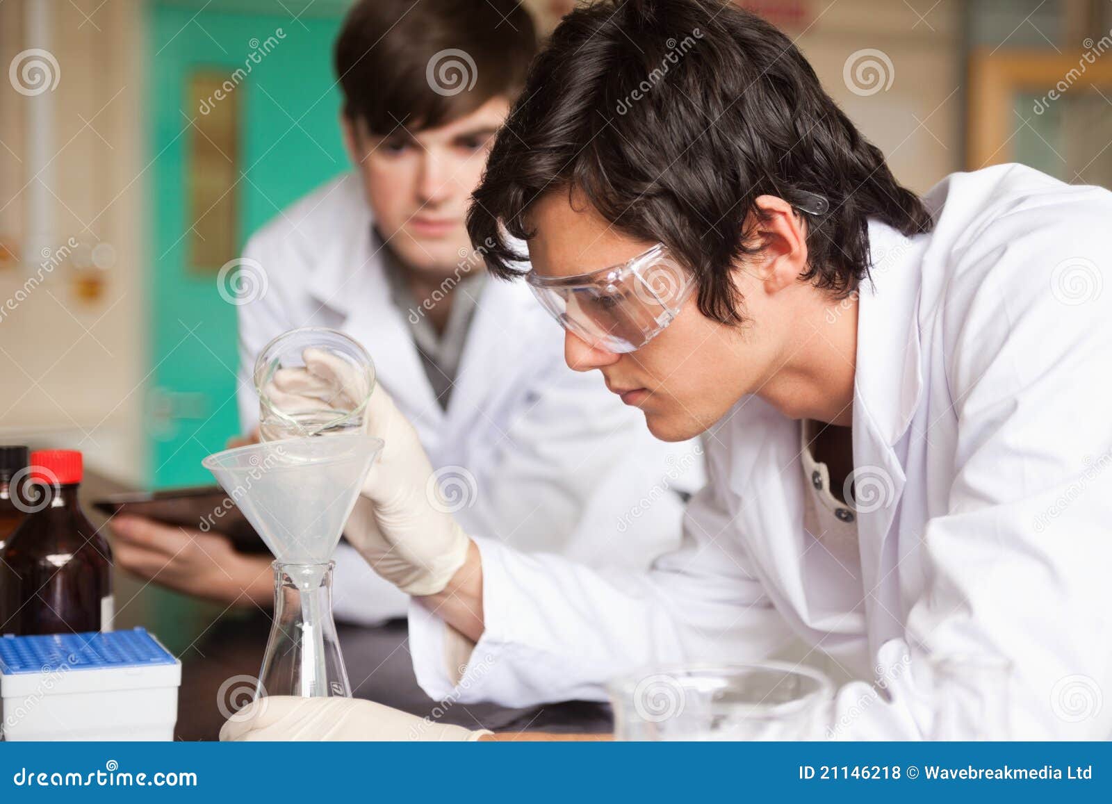 Students in Chemistry Making an Experiment Stock Photo - Image of ...