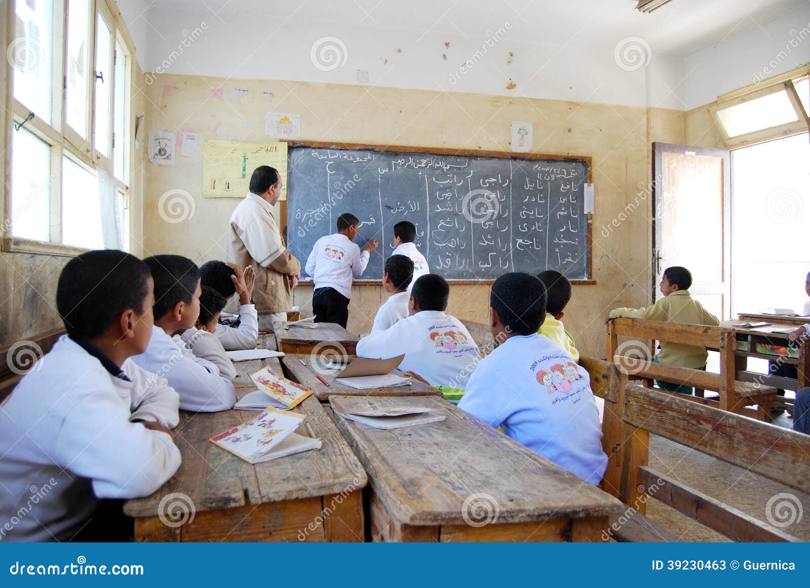 Students in Classroom Explaining on Blackboard Editorial Stock Photo ...