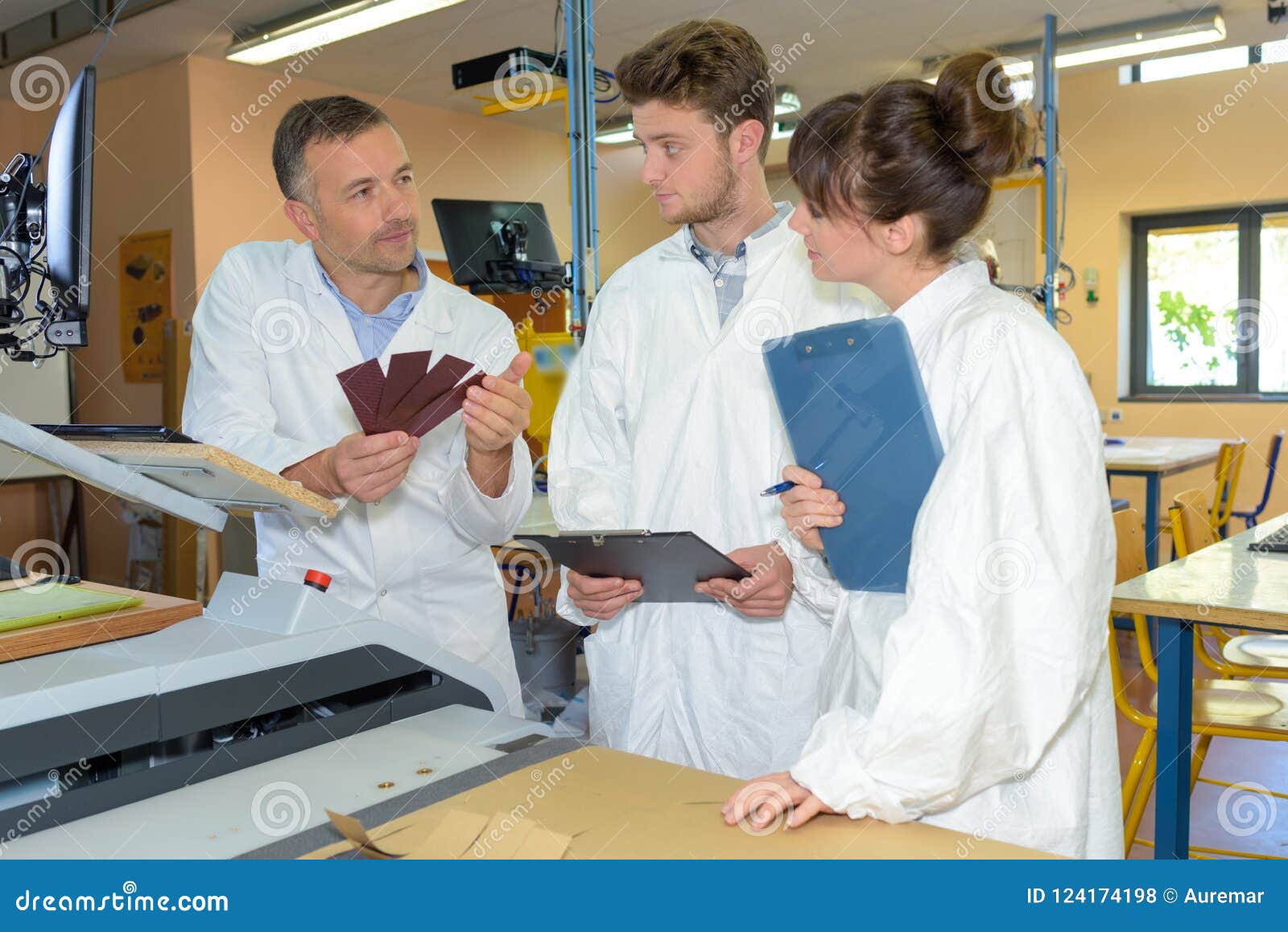 Students with Clipboards with Instructor Stock Photo - Image of teach ...