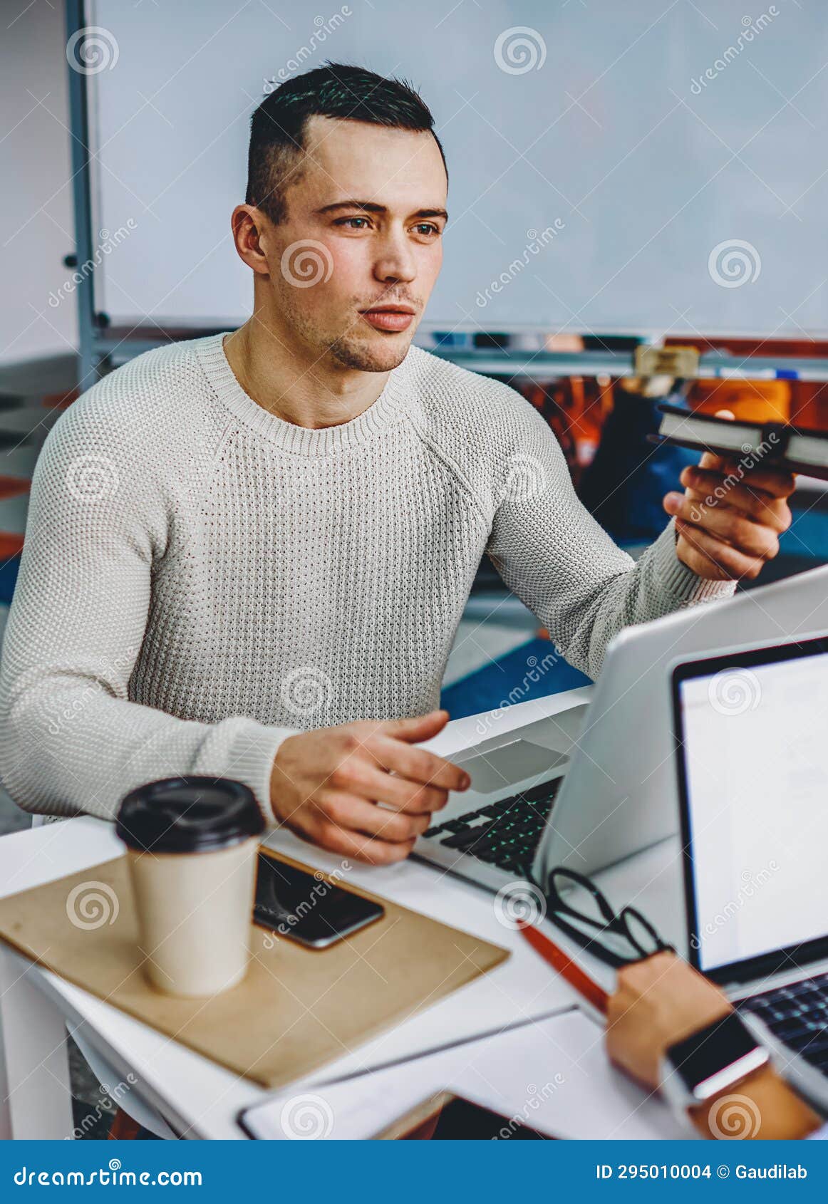 Students Collaborating on Common Task Using Book and Internet Stock ...