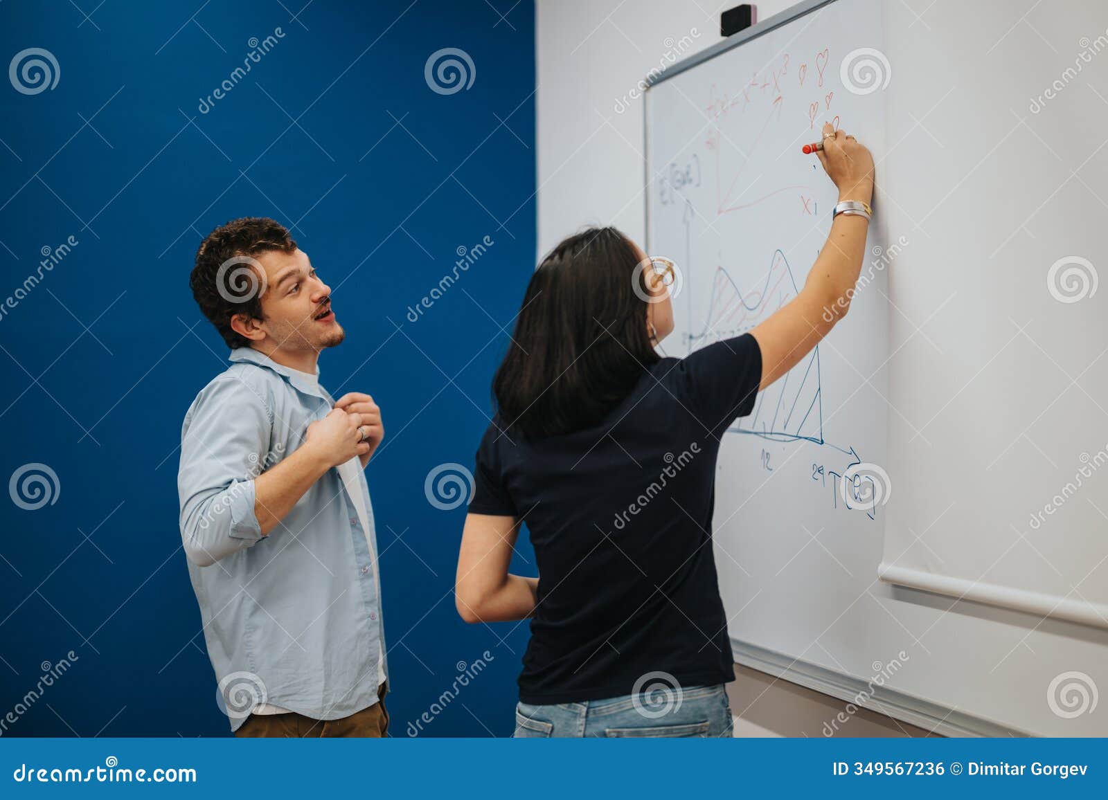 Students Collaborating on Mathematical Problem at School Classroom ...