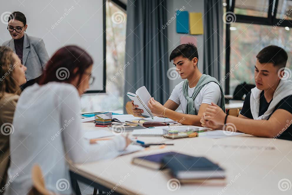 Students Collaborating in a Modern Classroom with Teacher Support Stock ...