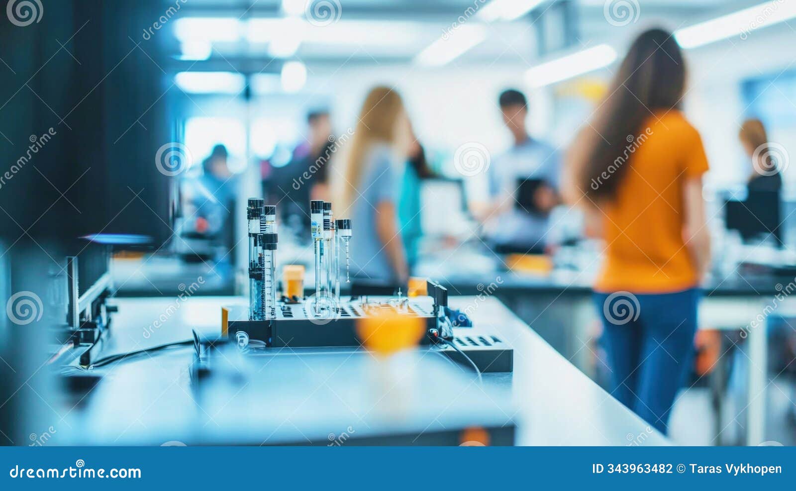 Students Collaborating in a Modern STEM Lab with Focus on Equipment and ...