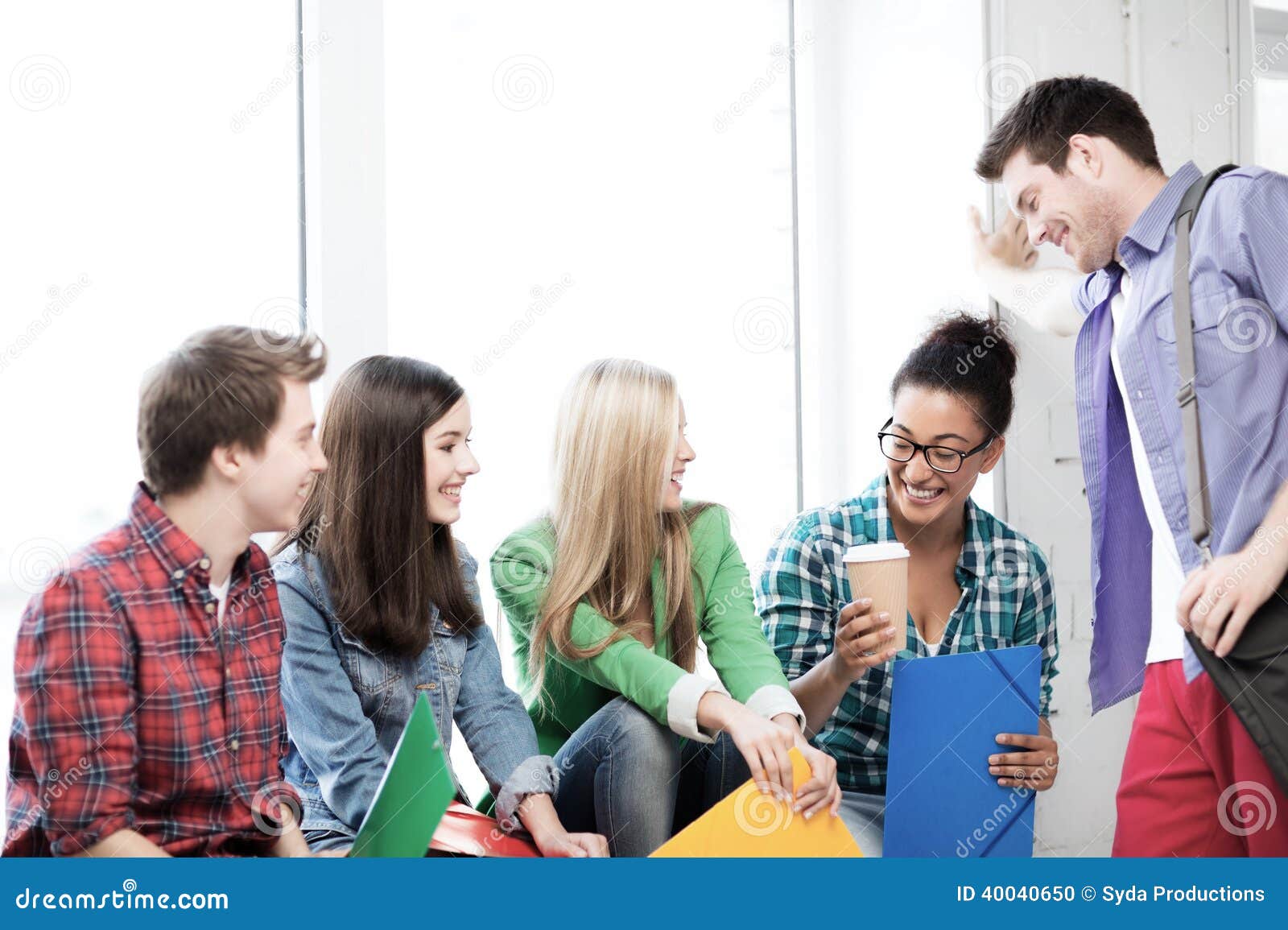 Students Communicating and Laughing at School Stock Photo - Image of ...