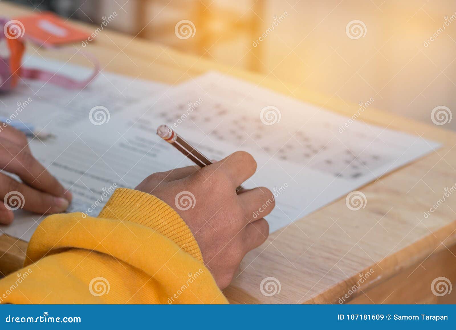 Students Concentration Holding Pencils in Hand Doing Multiple-choice ...
