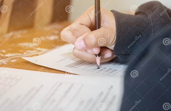 Students Concentration Holding Pencils in Hand Doing Multiple-choice ...
