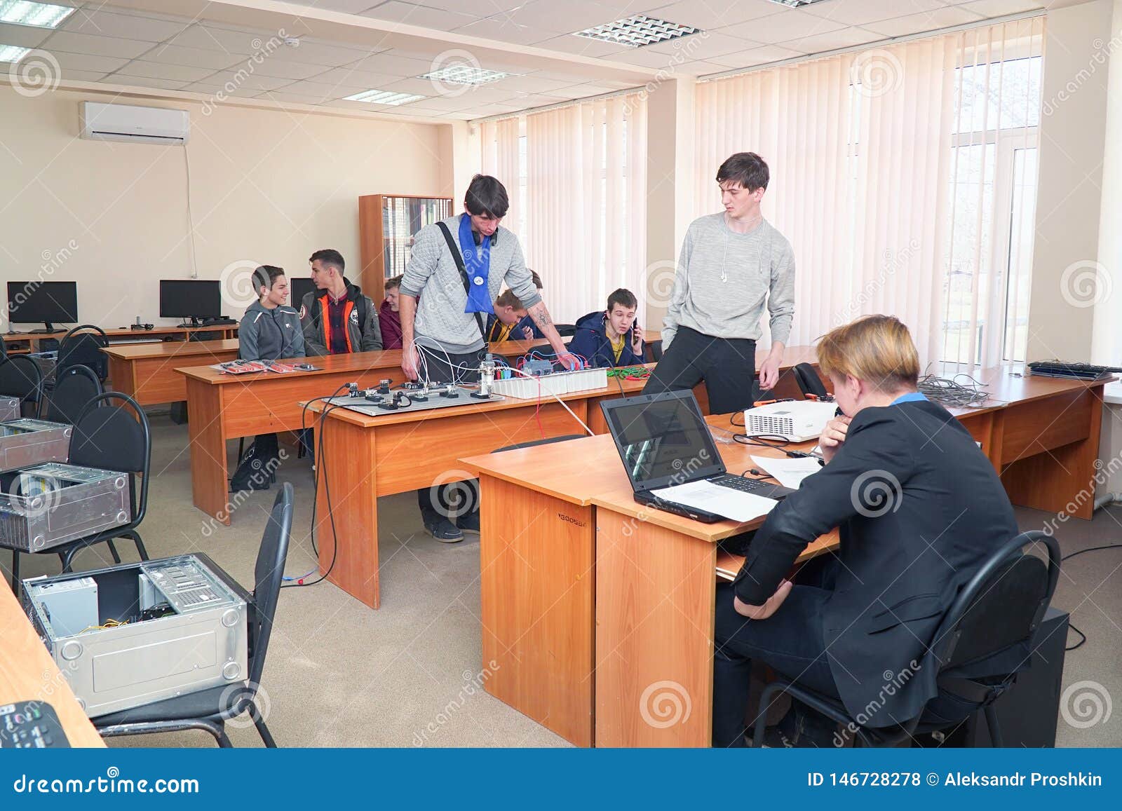 Students Connect Wires Control Panel with Small Test Bench for ...