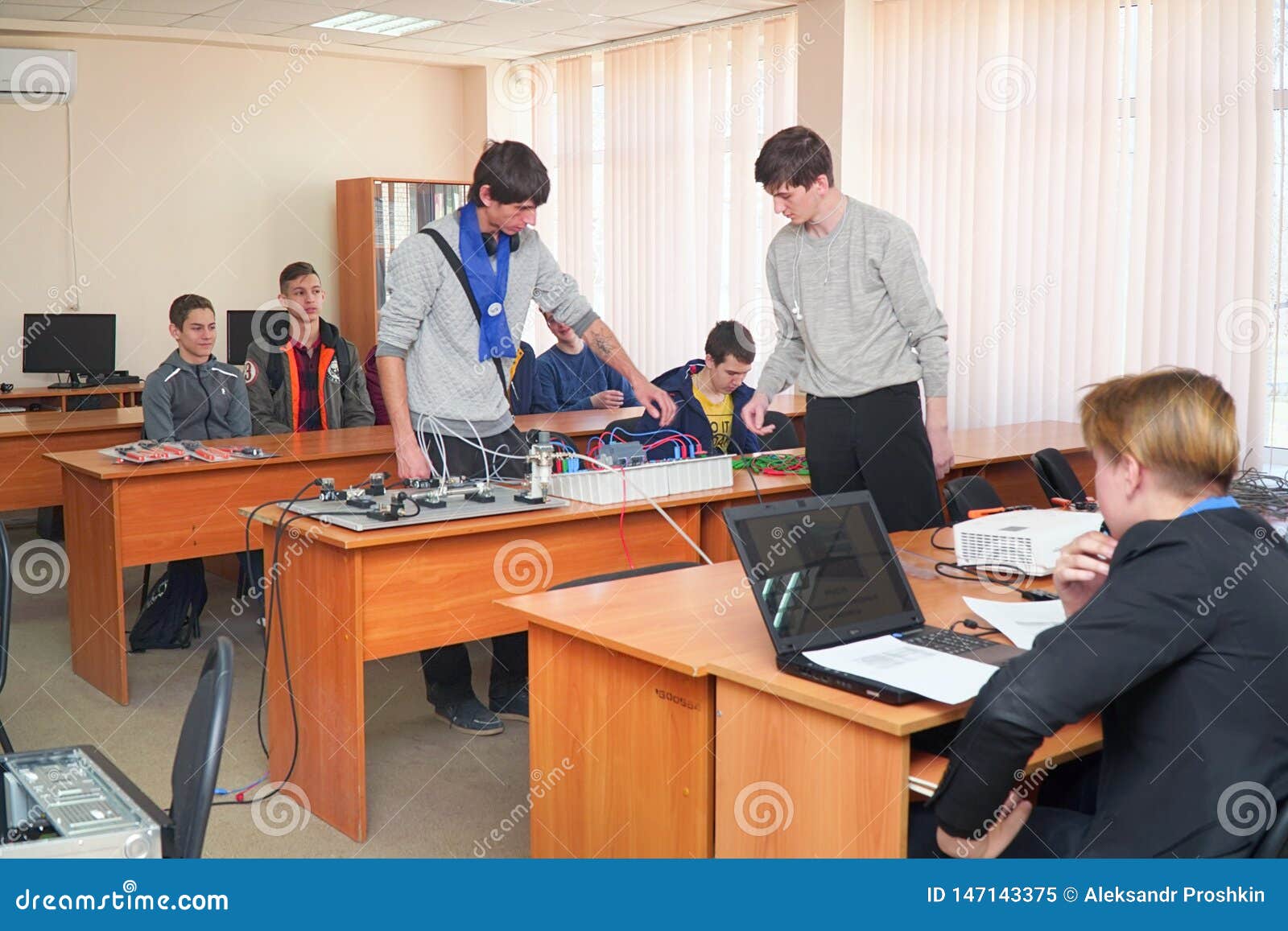 Students Connect Wires Control Panel with Small Test Bench for ...