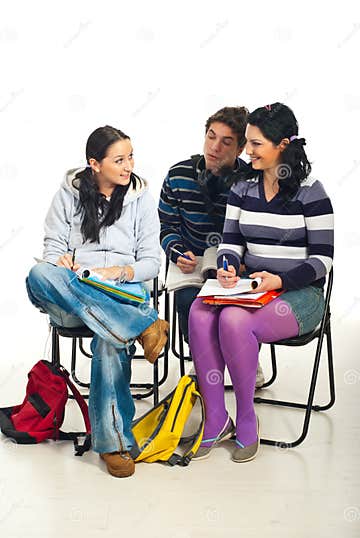 Students Conversation in Classroom Stock Photo - Image of books, girls ...