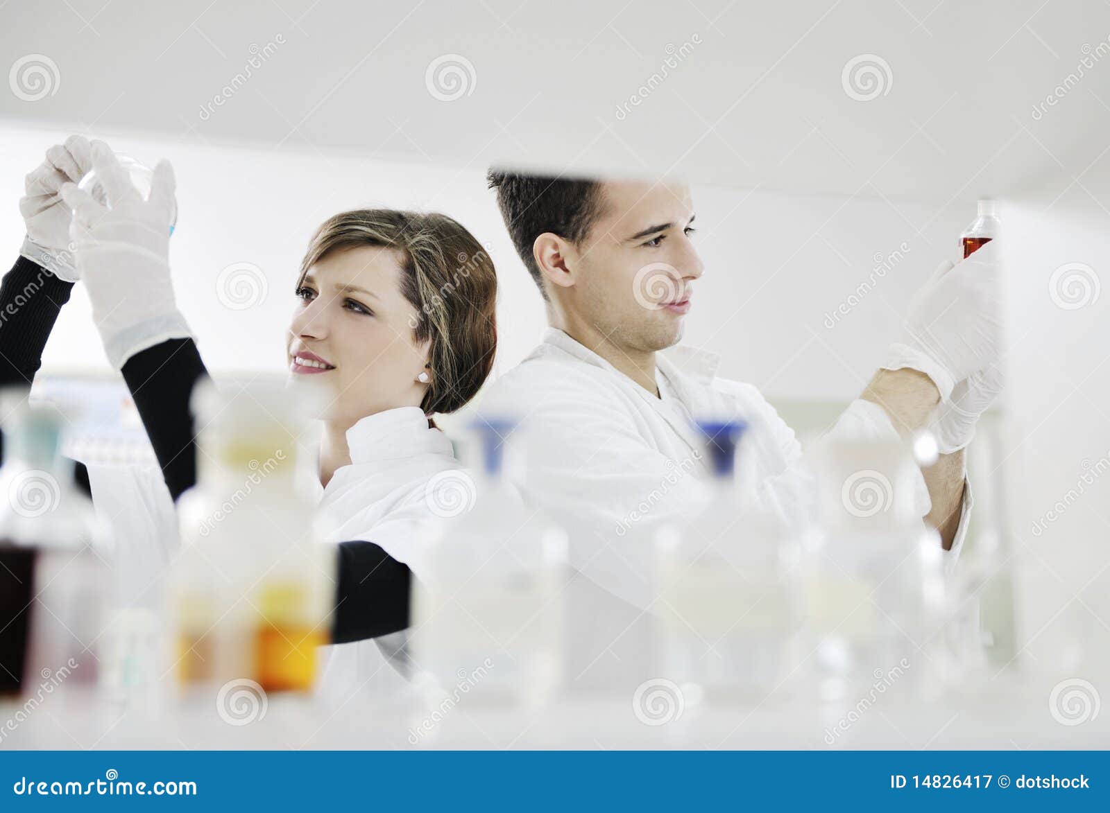 Students couple in lab stock image. Image of research - 14826417