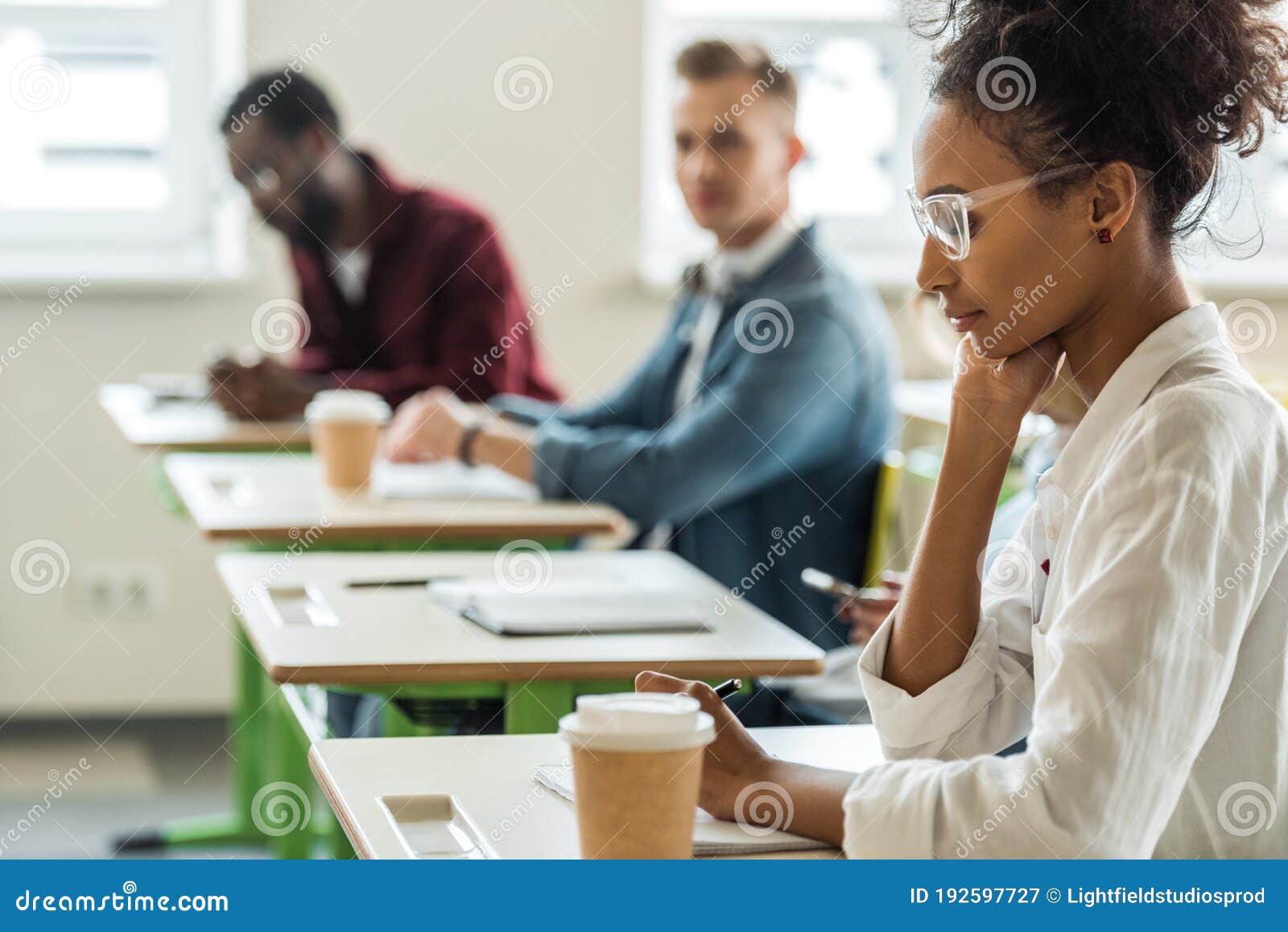 Students at Desks Writing during Lecture in College Stock Image - Image ...
