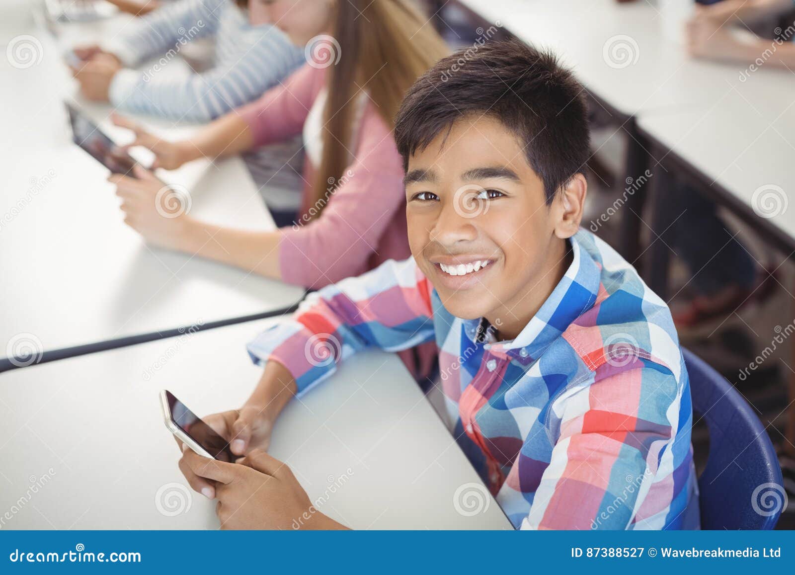 Students with Digital Tablet and Mobile Phone in Classroom Stock Image ...