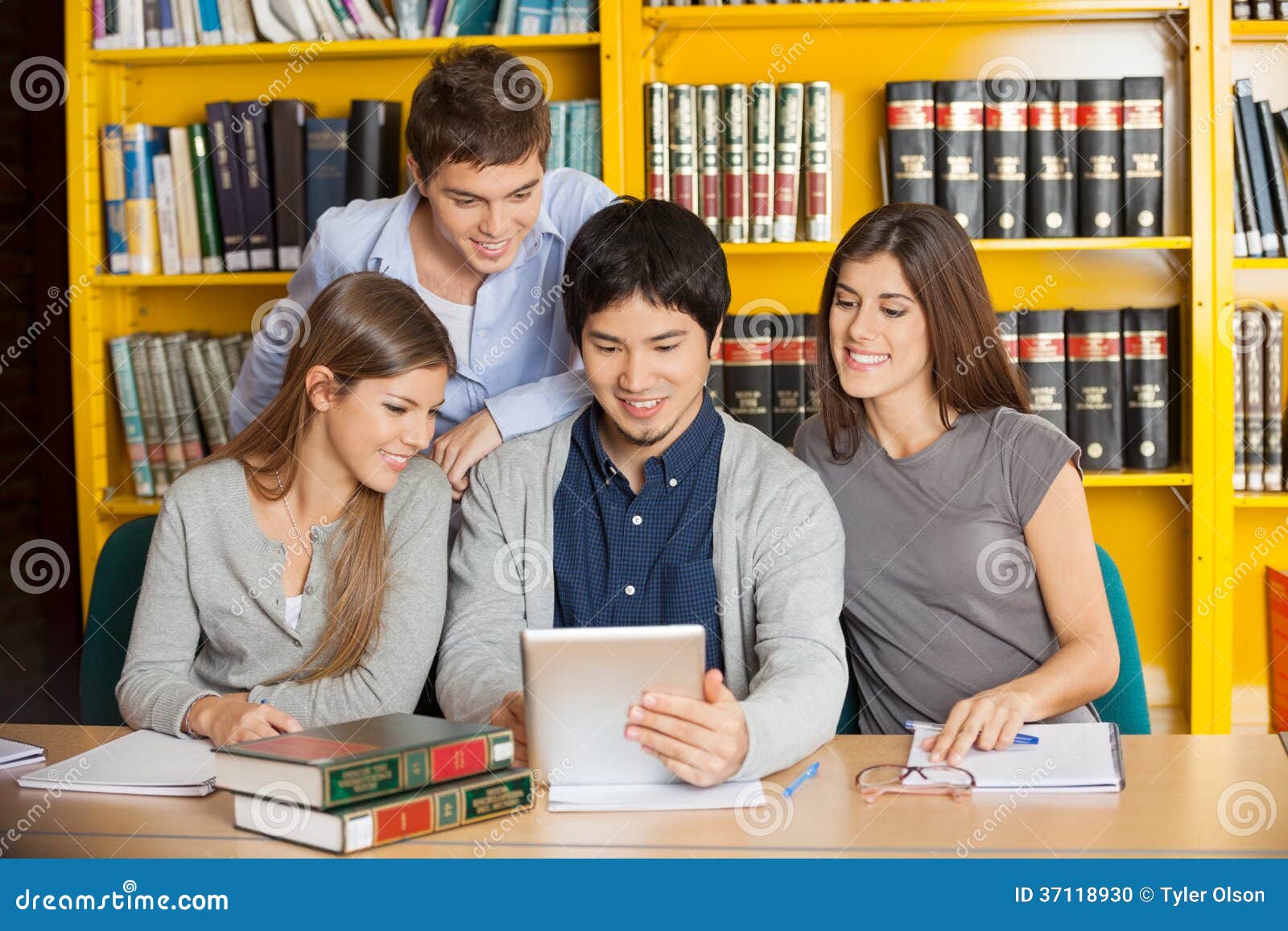 Students with Digital Tablet Studying Together in Stock Photo - Image ...
