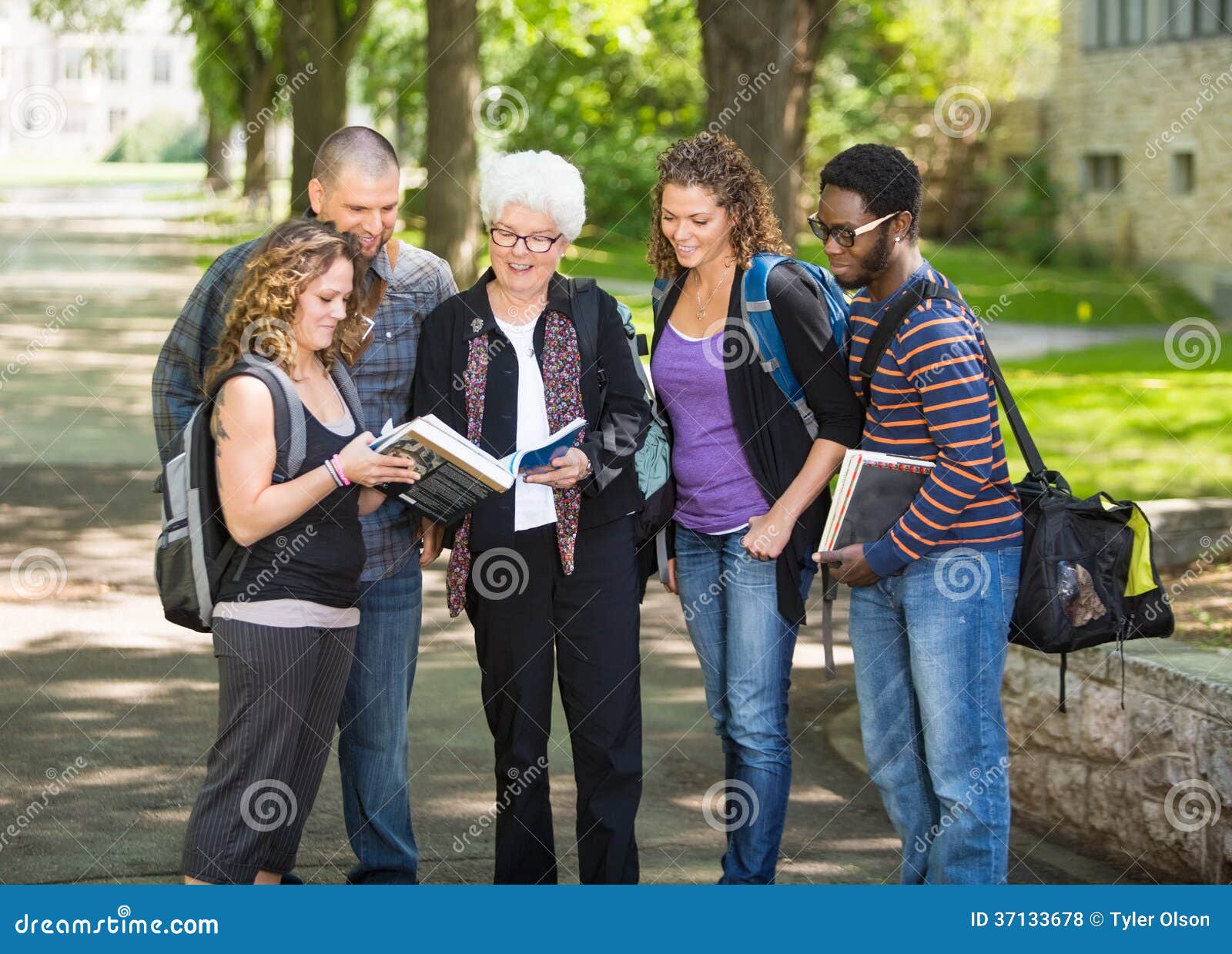 Students Discussing Notes on Campus Stock Photo - Image of book ...