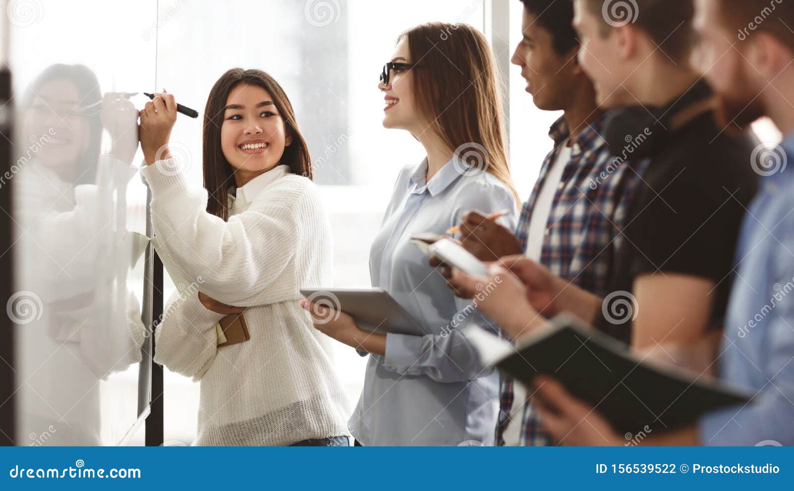 Students Discussing Tasks on Whiteboard in Classroom Stock Photo ... Students Discussing Tasks on Whiteboard in Classroom Stock Photo ...