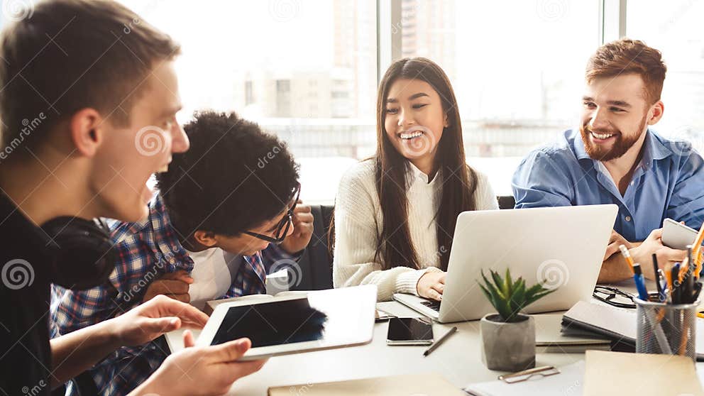 Students of Diverse Backgrounds Using Tech in Study Stock Image - Image ...