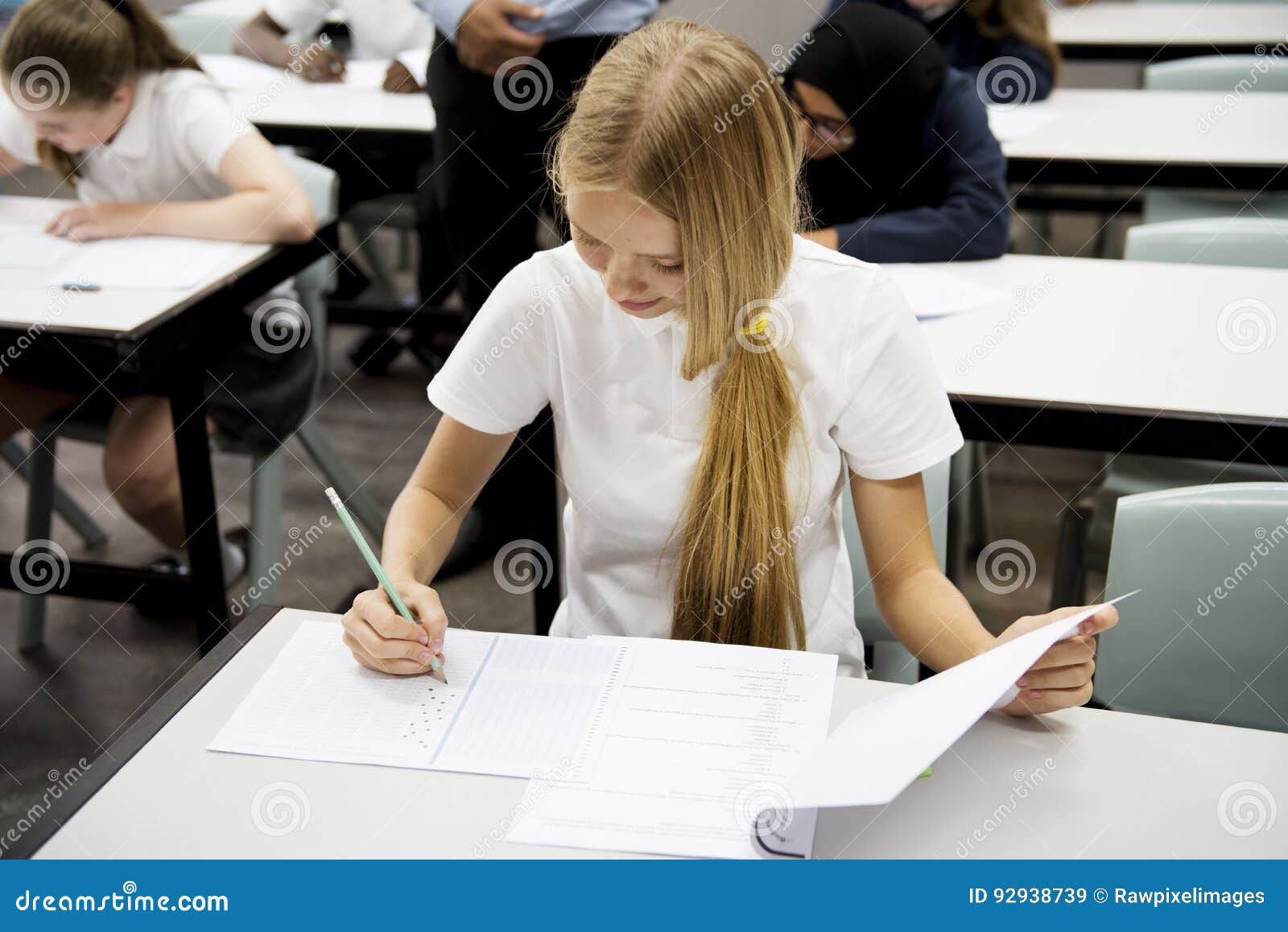 Students Doing the Exam in Classroom Stock Image - Image of high ...