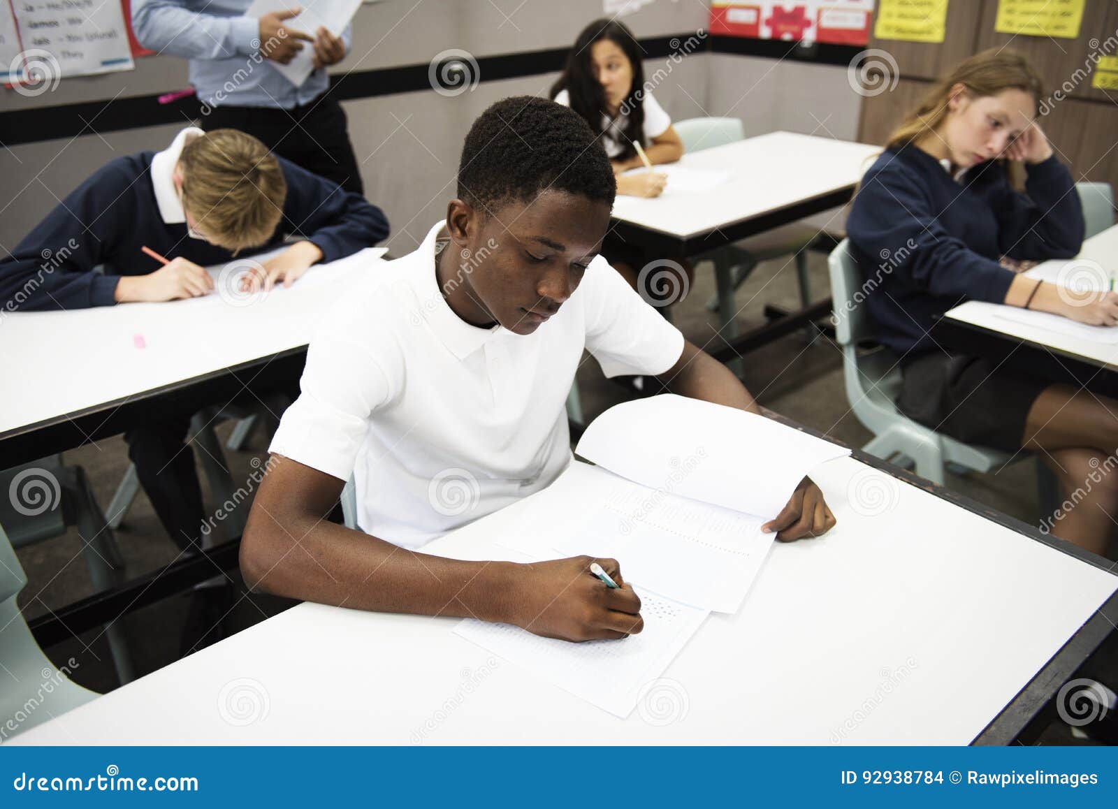 Students Doing the Exam in Classroom Stock Photo - Image of teacher ...