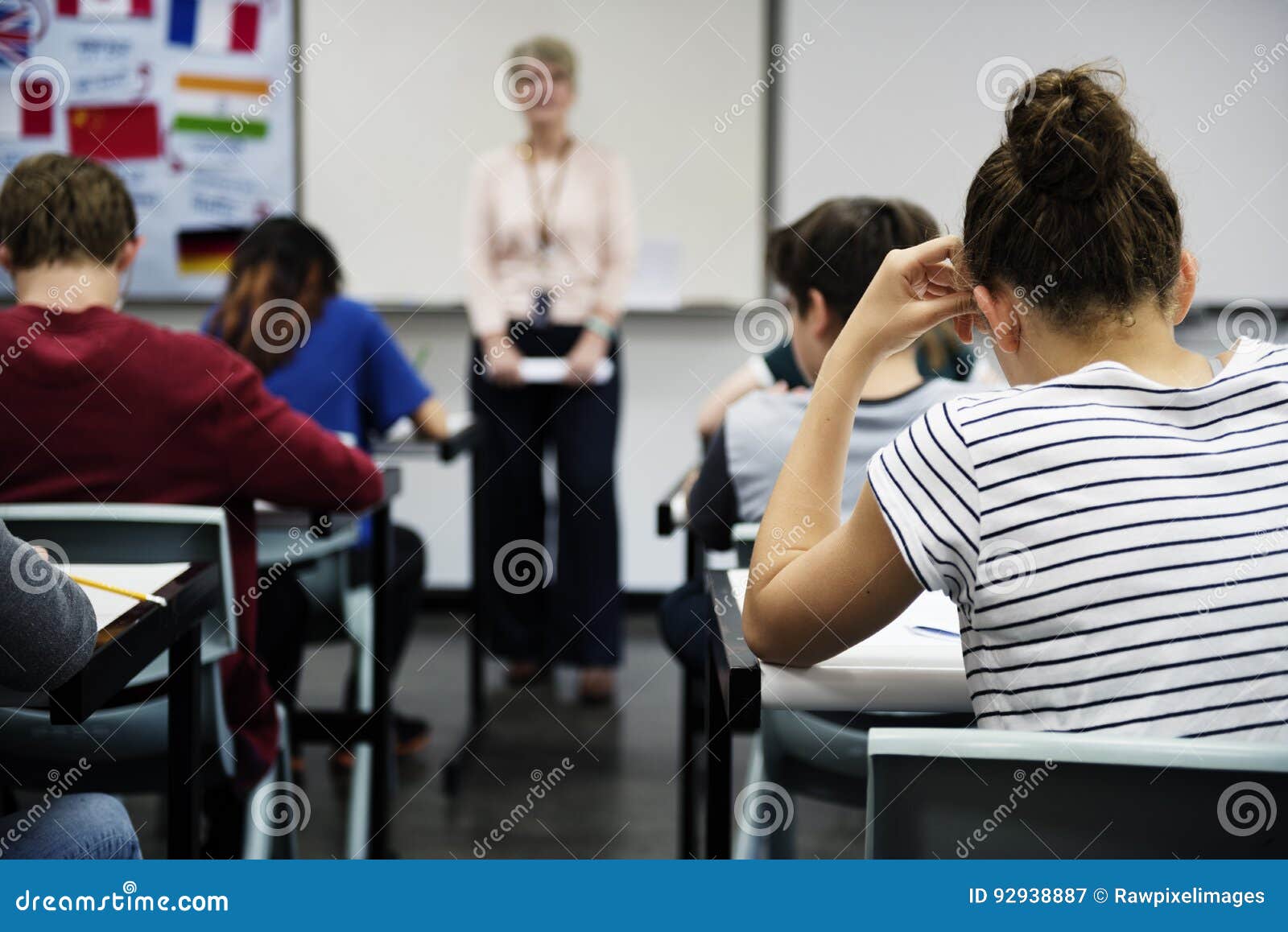 Students Doing the Exam in Classroom Stock Image - Image of classmates ...