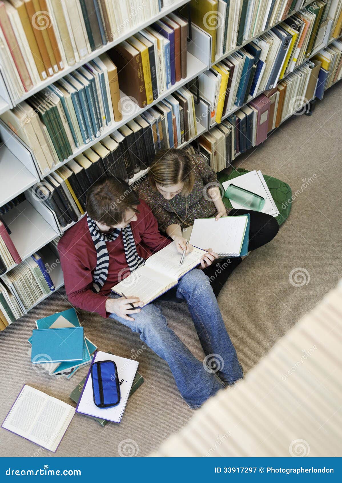 Students Doing Homework on Floor in Library Editorial Photography ...