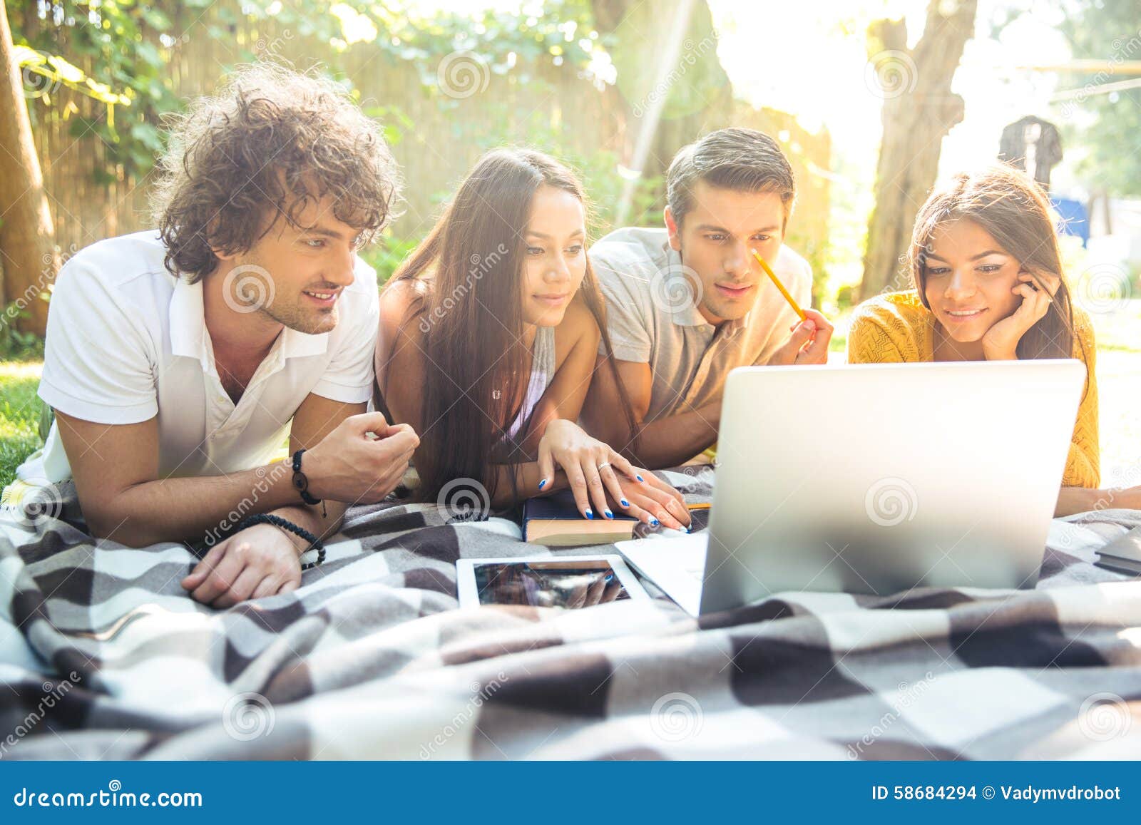 Students Doing Homework on the Laptop Together Stock Photo - Image of ...
