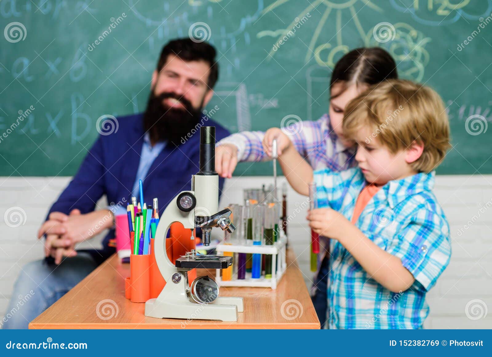 Students Doing Science Experiments with Microscope in Lab. Back To ...