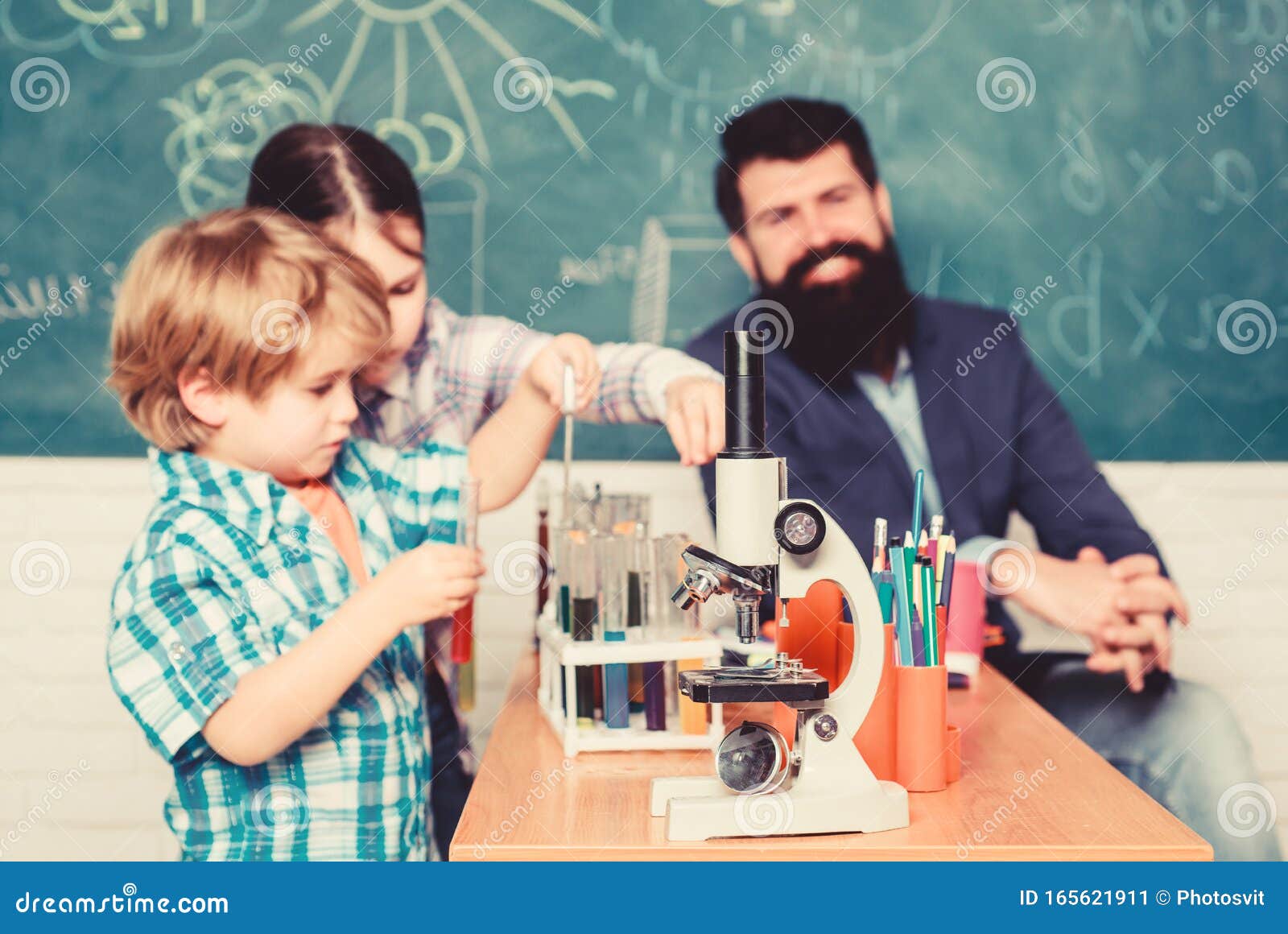 Students Doing Science Experiments with Microscope in Lab. Back To ...