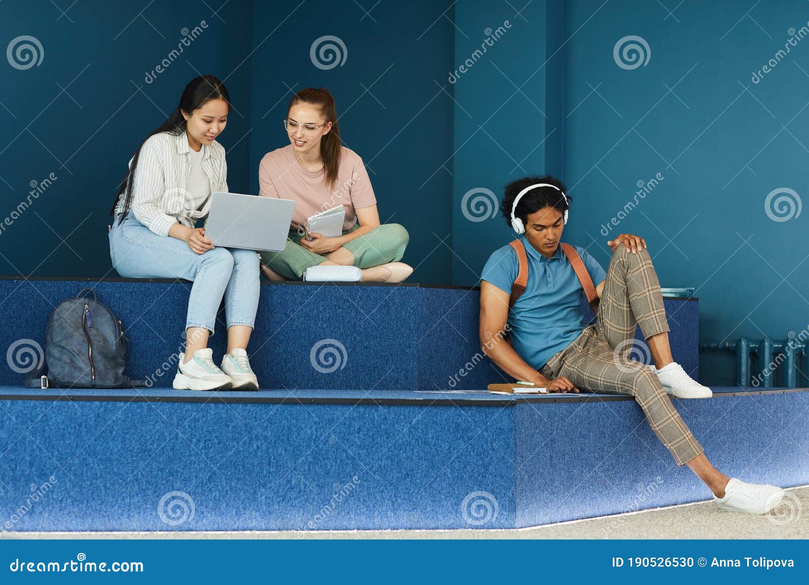 Students Doing Task before Class Stock Photo - Image of adult, studying ...