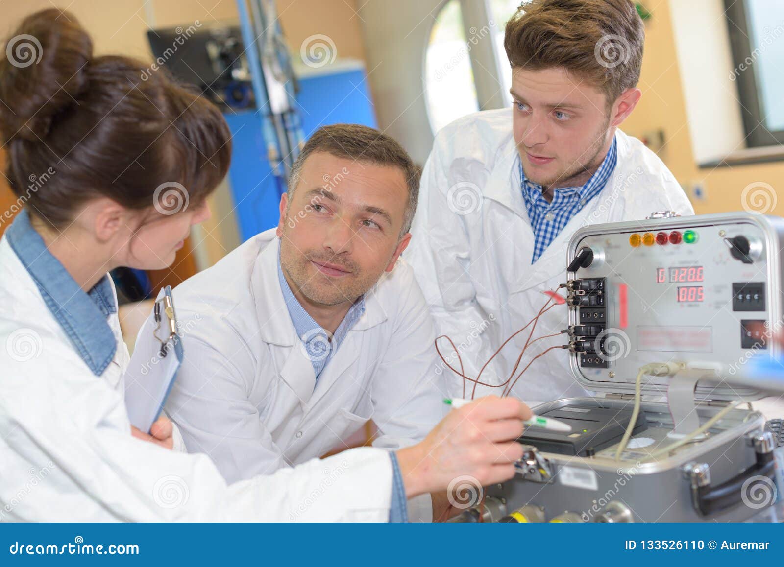 Students in Electrical Engineering Course Training with Teacher Stock ...
