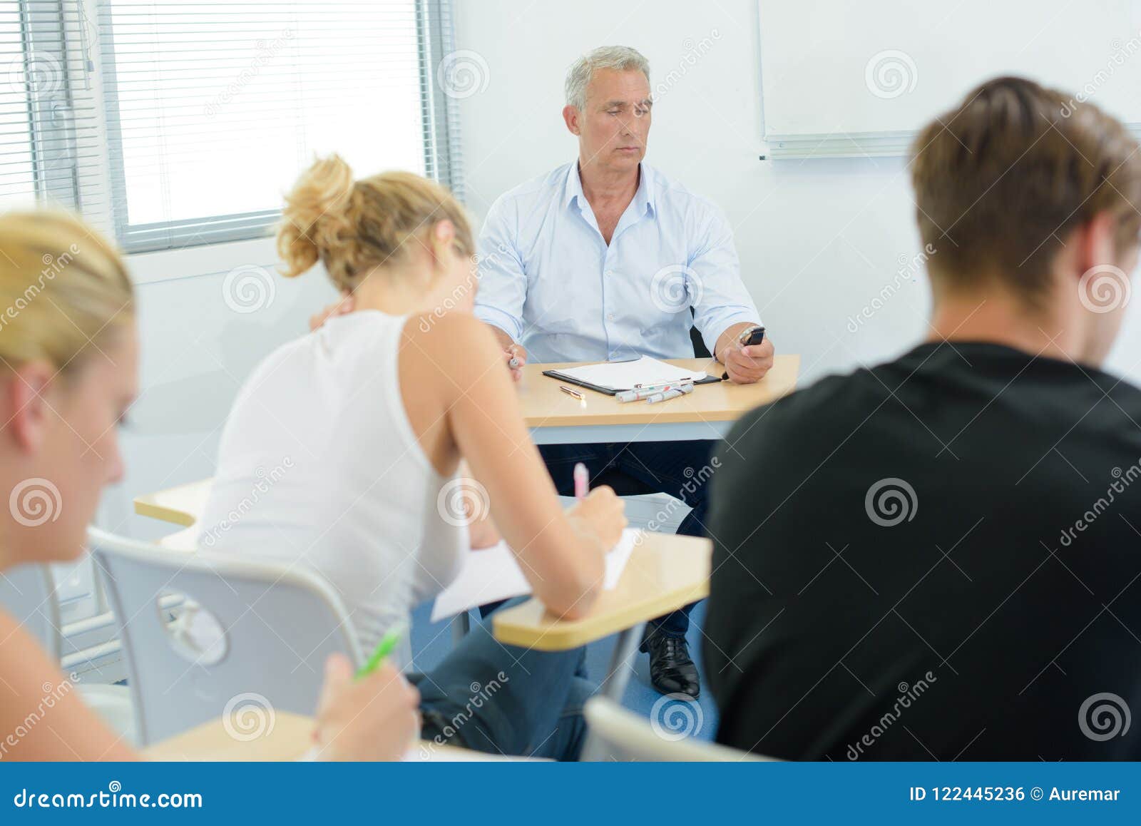 Students during an exam stock photo. Image of school - 122445236