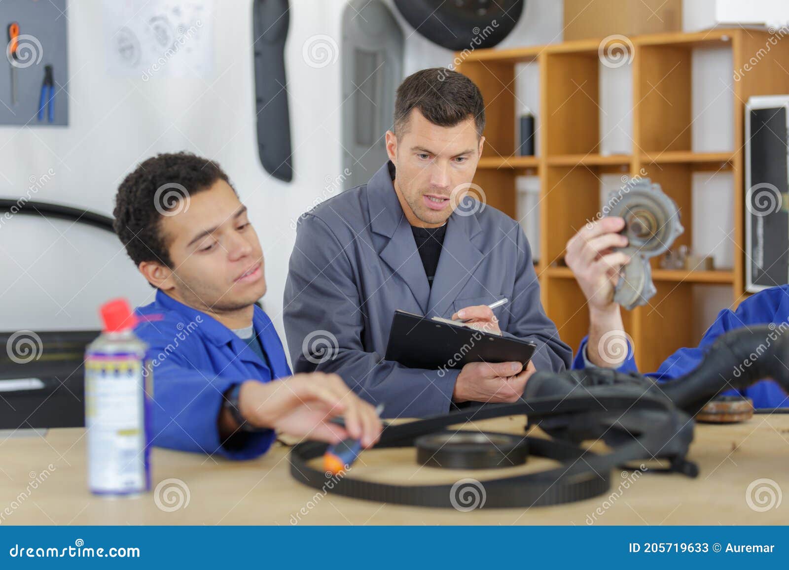 Students Examining Automotive Components on Workbench Stock Image ...
