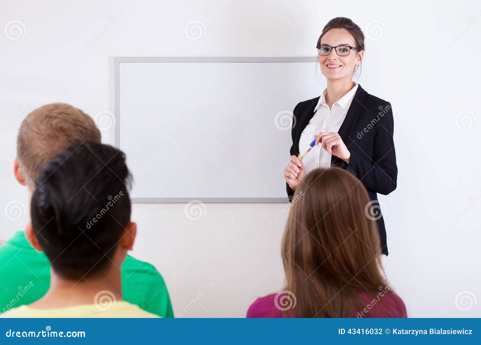 Students and Female Teacher in Classroom Stock Photo - Image of ...